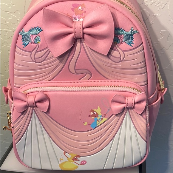 Loungefly | Bags | Loungefly Pink And Yellow Cartoon Character Backpack ...